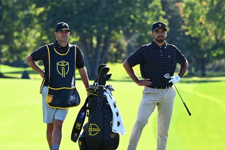 Who is Jason Day's caddie?